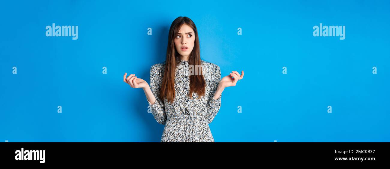 Confused cute girl cant understand something, look away pensive and ...