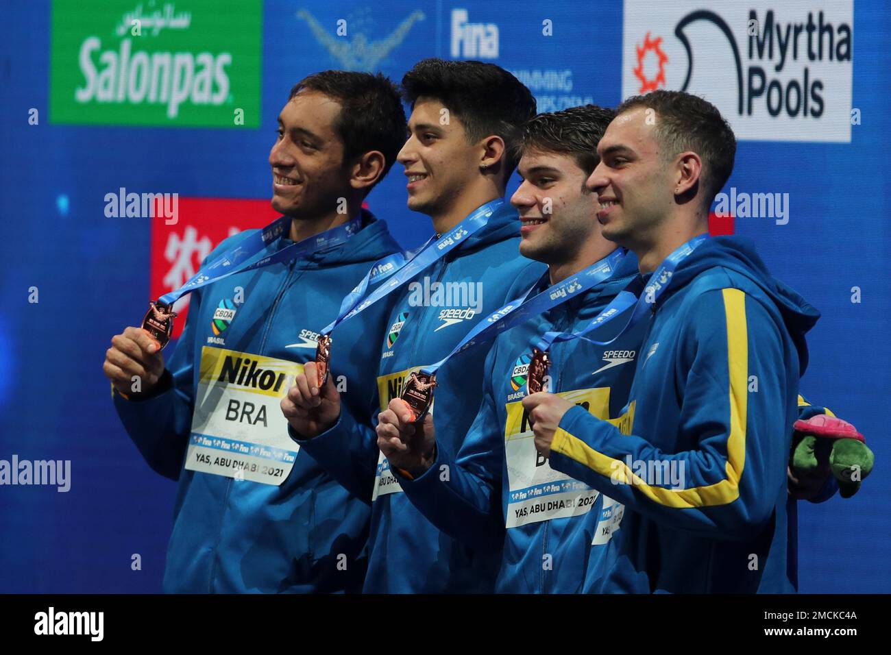 Team Brazil standson the podium after winning bronze in the 4x200 ...