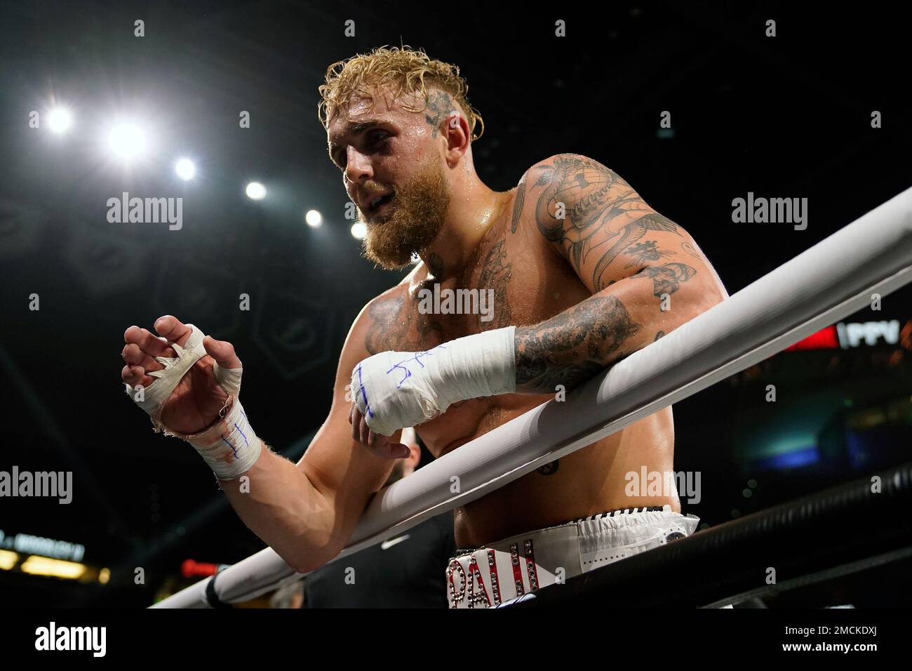 Jake Paul reacts after knocking out Tyron Woodley during the sixth ...