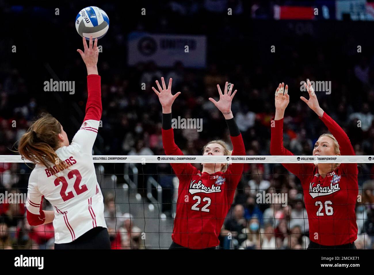 Wisconsin's Julia Orzol (22) spikes the ball towards Nebraska's Lindsay ...