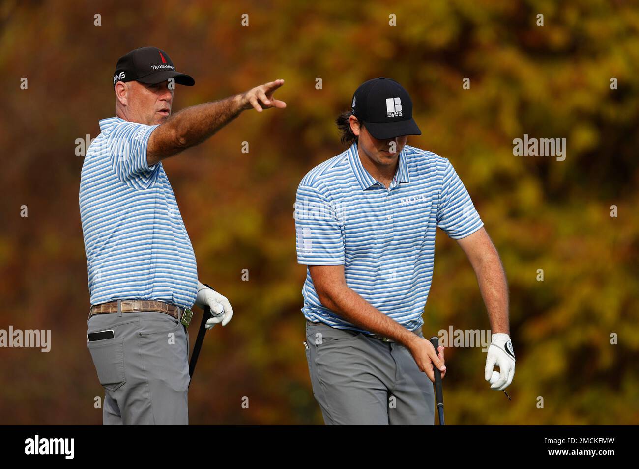 Stewart Link, left, talks with his son Reagan Cink on the 18th hole ...