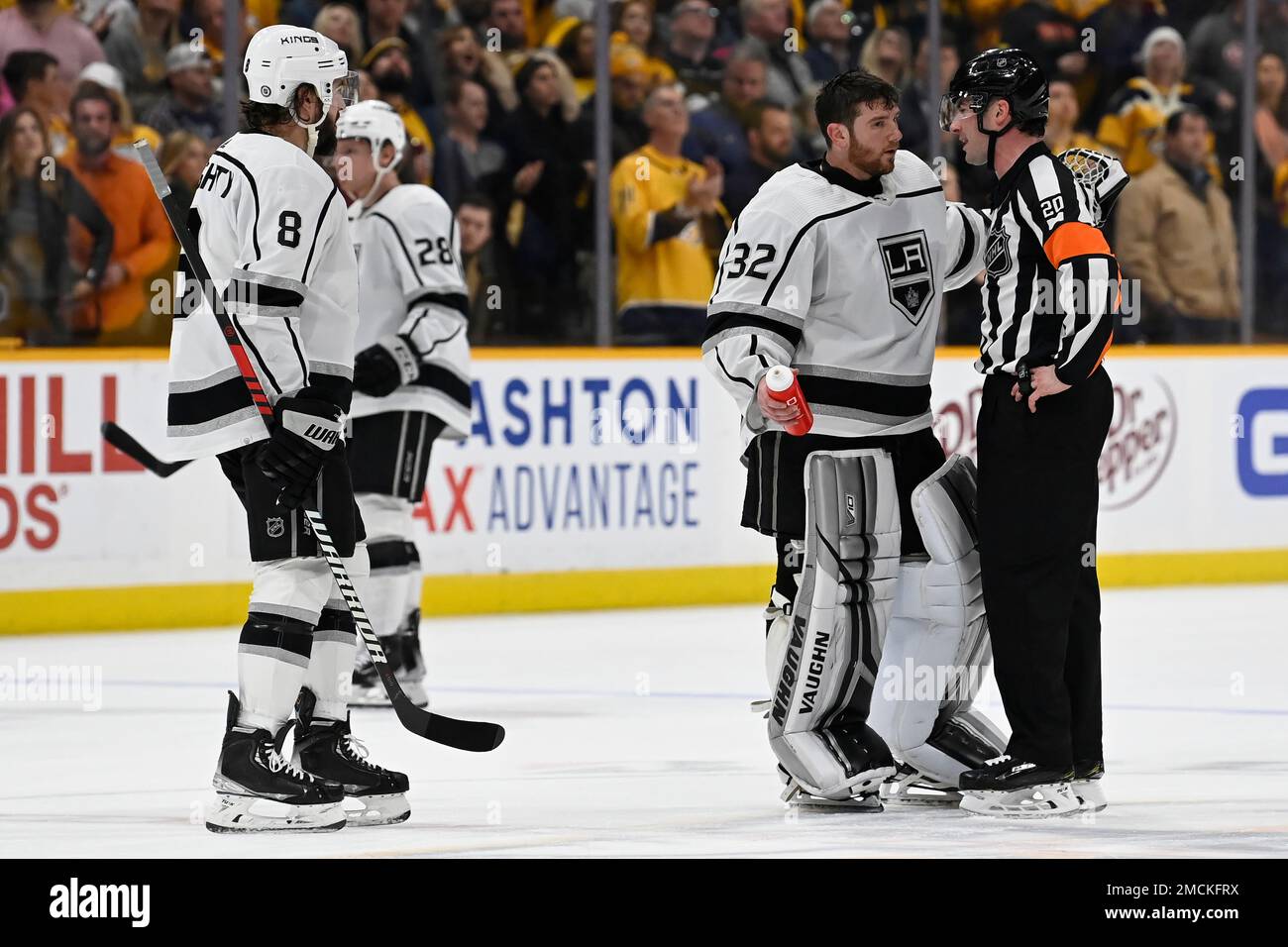 Los Angeles Kings goaltender Jonathan Quick (32) talks with referee ...