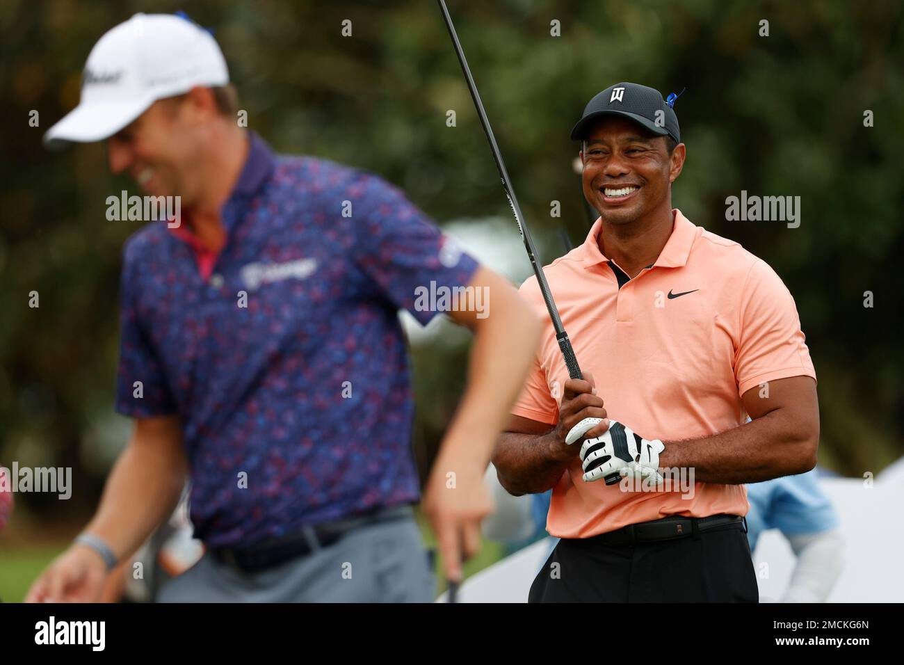 Tiger Woods, right, laughs with Justin Thomas on the 17th tee during ...