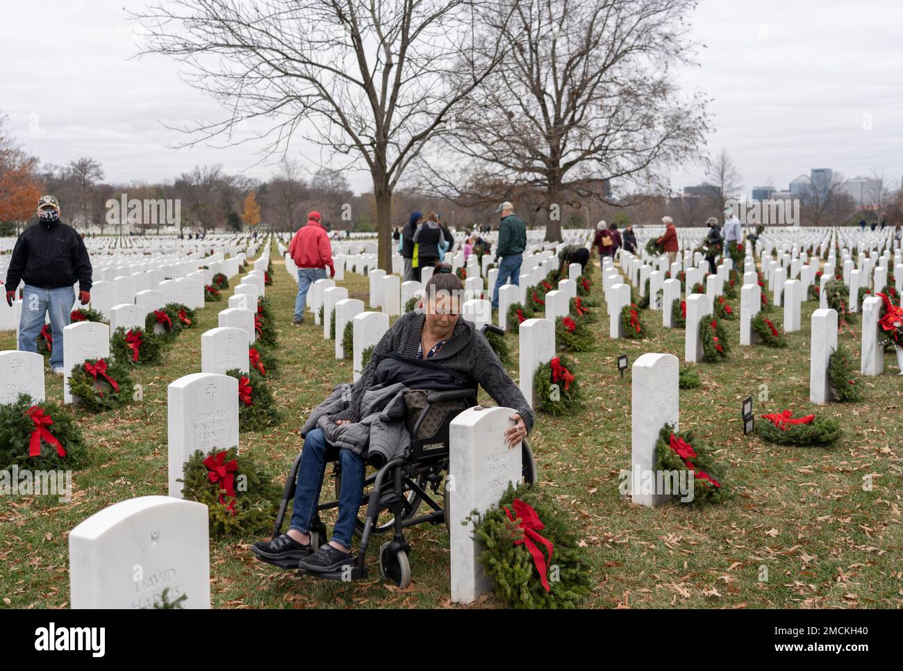 Patricia Berkey grieves at the headstone of her late husband William ...