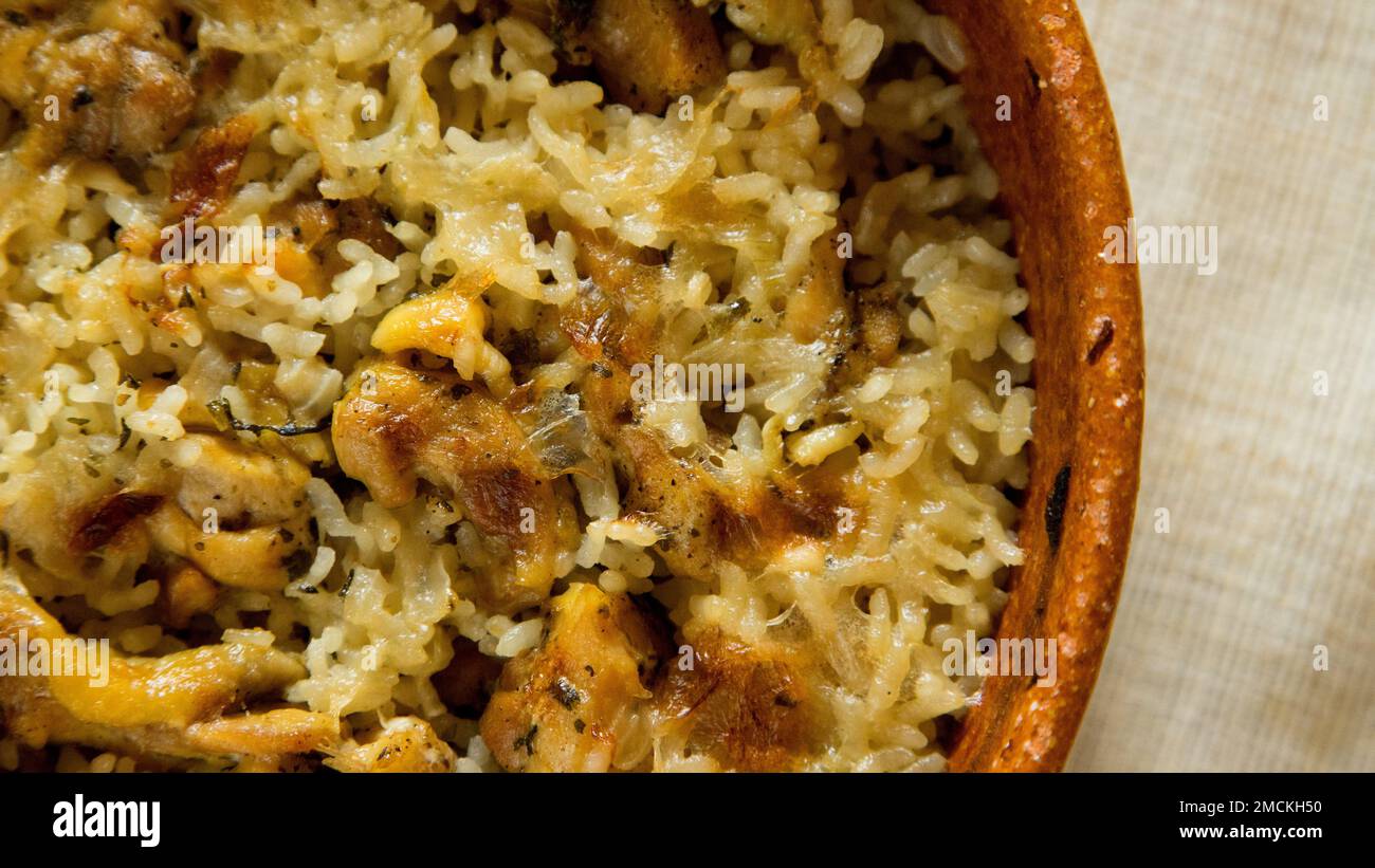 Original spanish paella recipe with meat cooked in a casserole in the ...