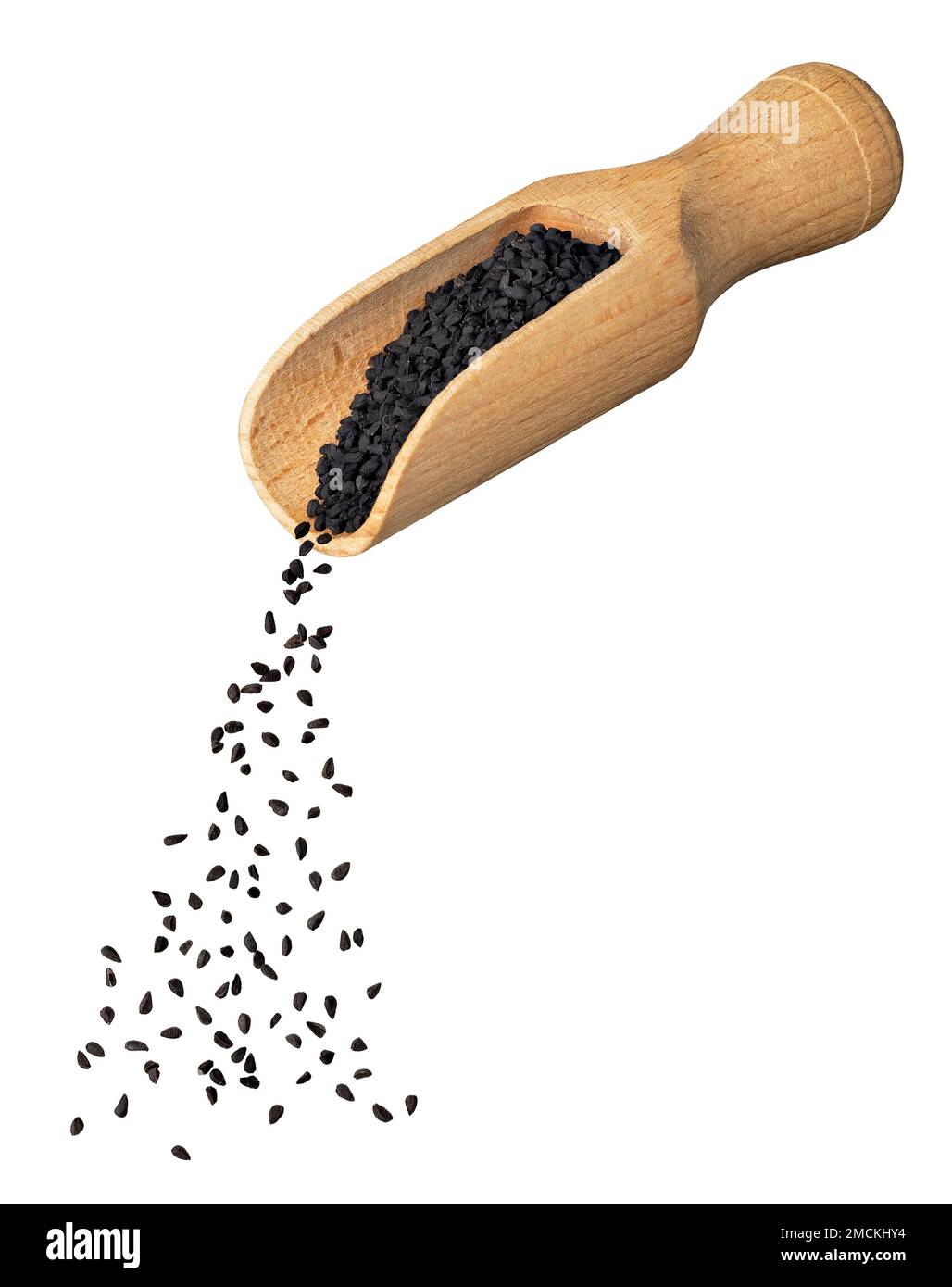 black cumin seeds falling from wooden scoop isolated on white Stock ...