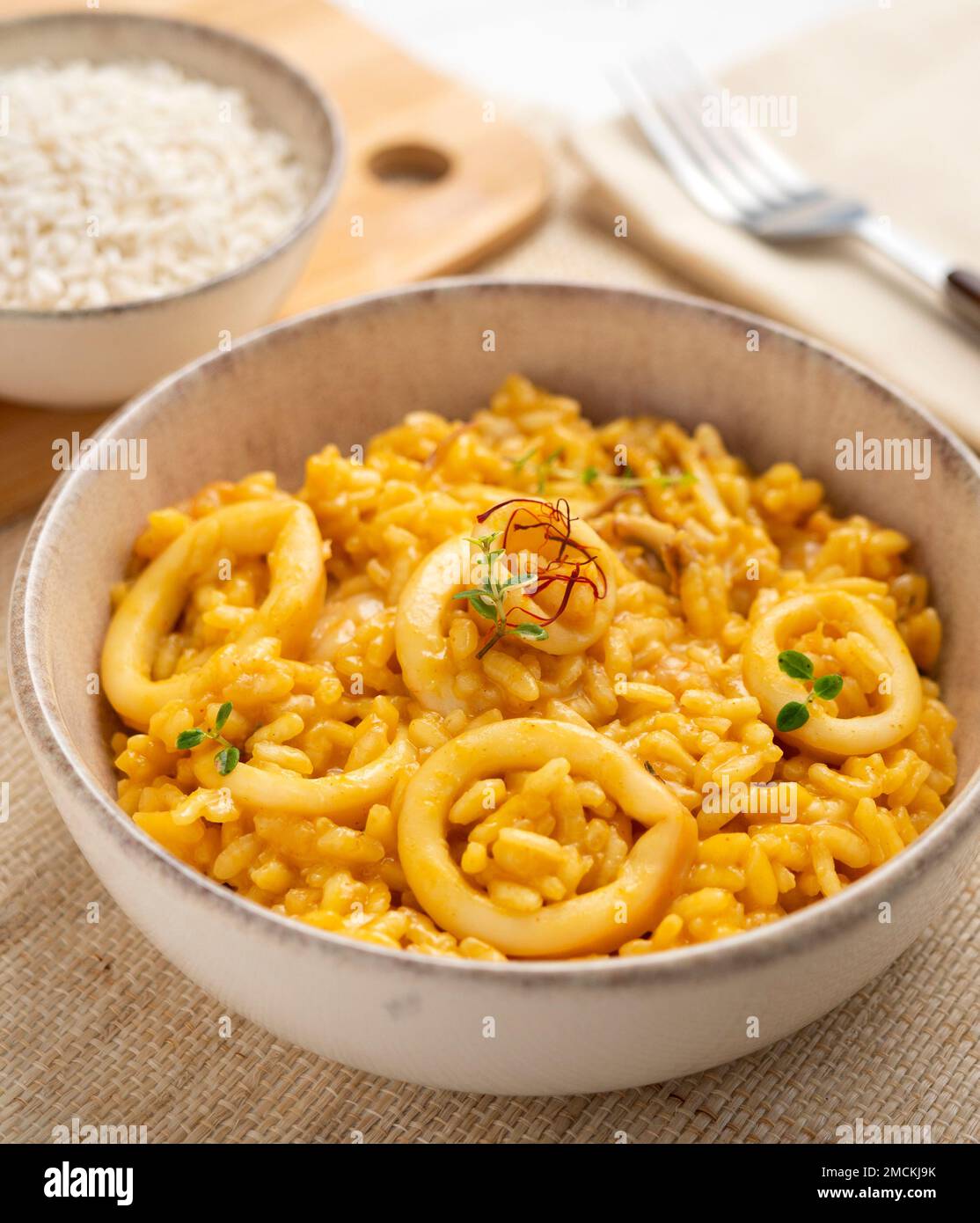 Original spanish paella recipe with squid and vegetables Stock Photo ...