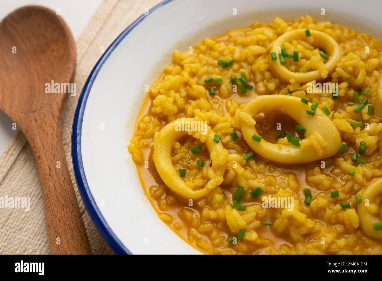 Original spanish paella recipe with squid and vegetables Stock Photo ...