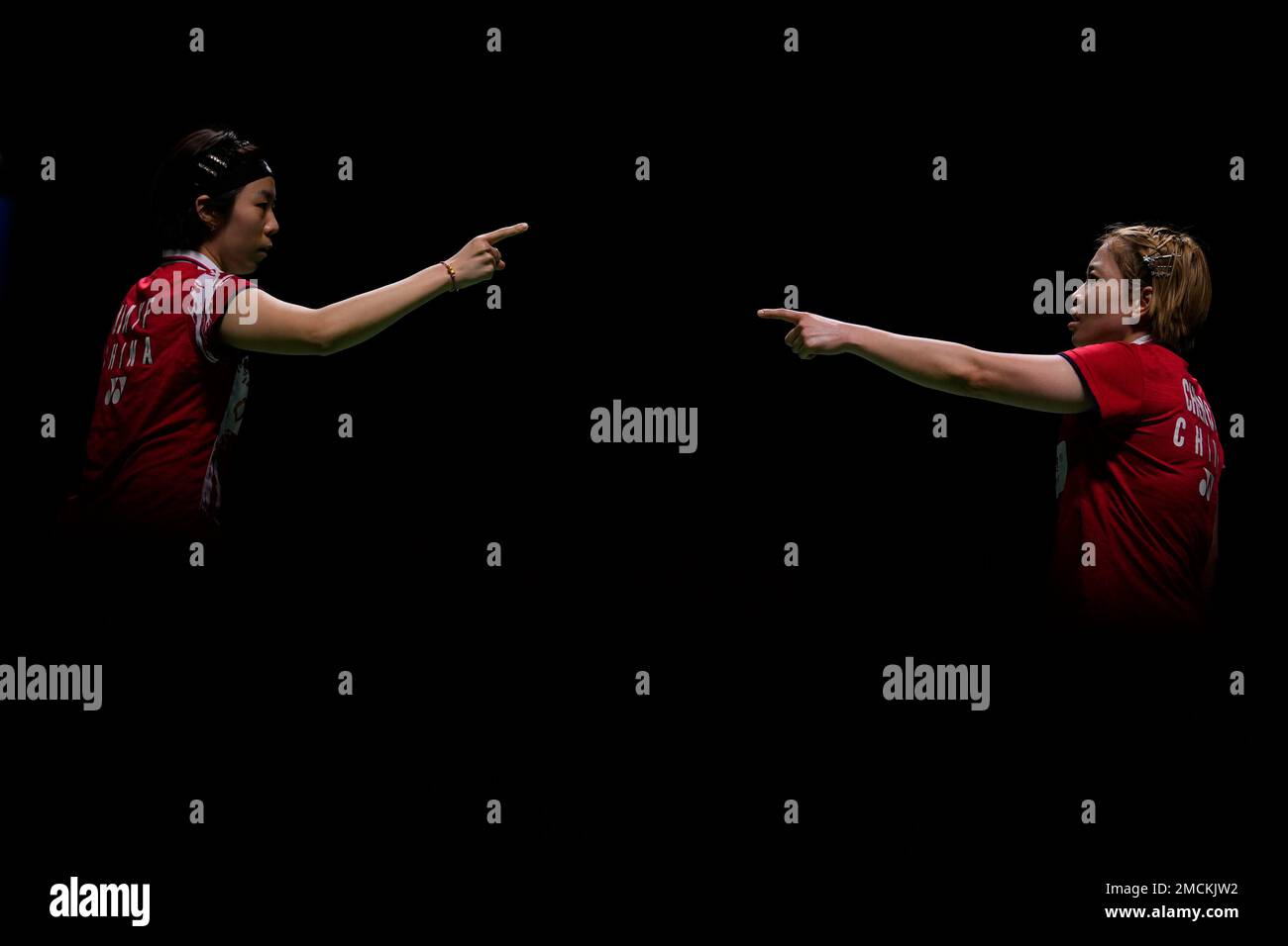 China's Jia Yi Fan, left and Chen Qing Chen celebrate winning a point against Japan's Mayu ...
