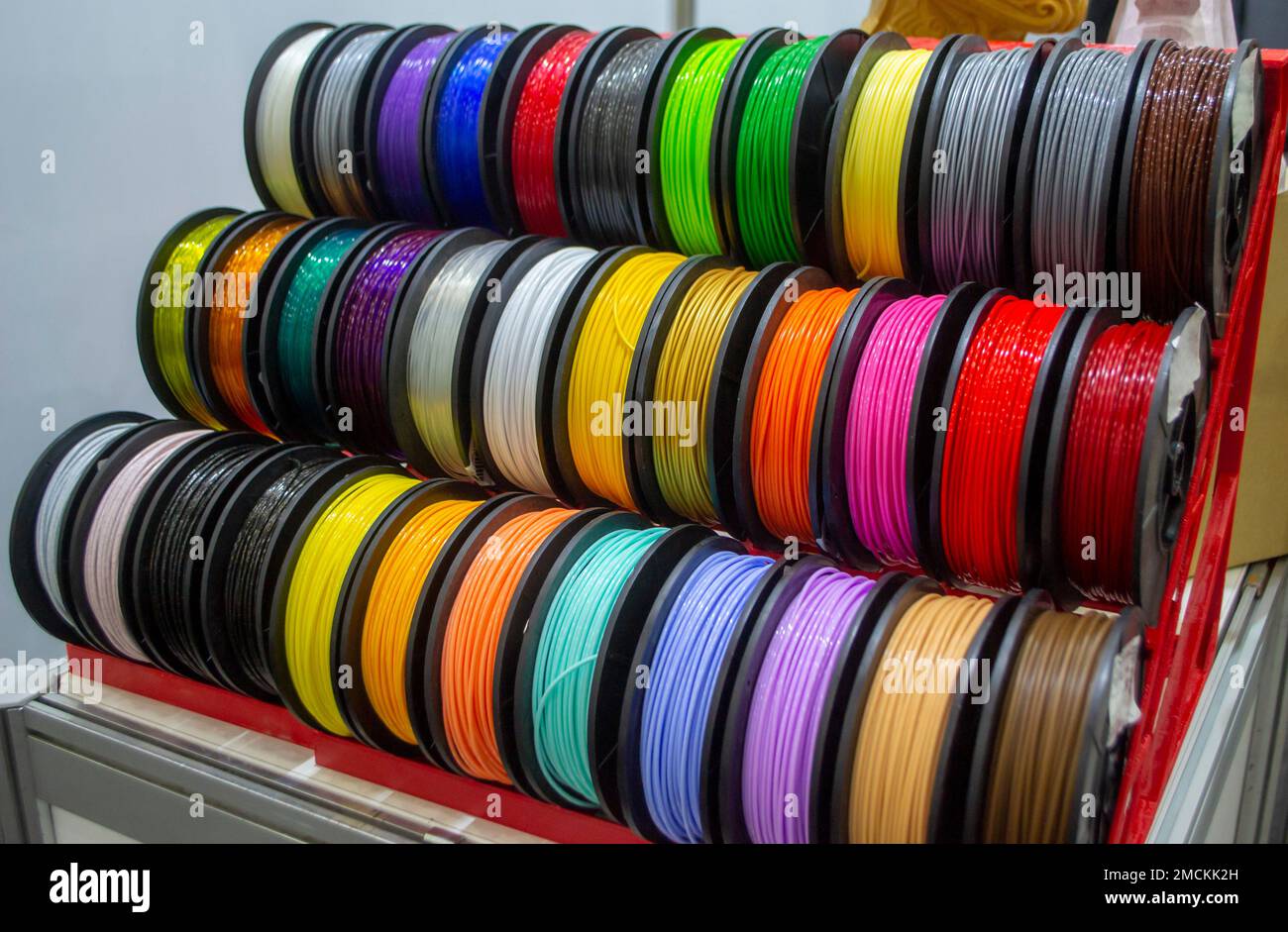 Many multi-colored spools of thread of filament for printing 3d printer ...