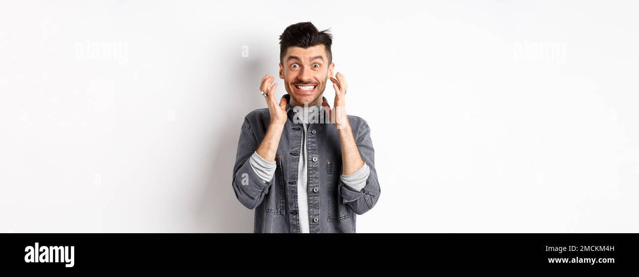 Angry man clench teeth and stare with hatred and anger at camera ...