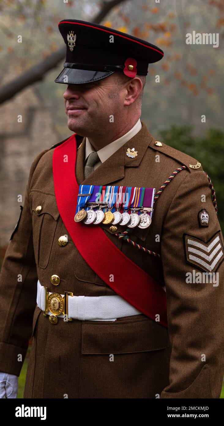 A vertical shot of a Caucasian soldier smiling, wearing a uniform Stock ...