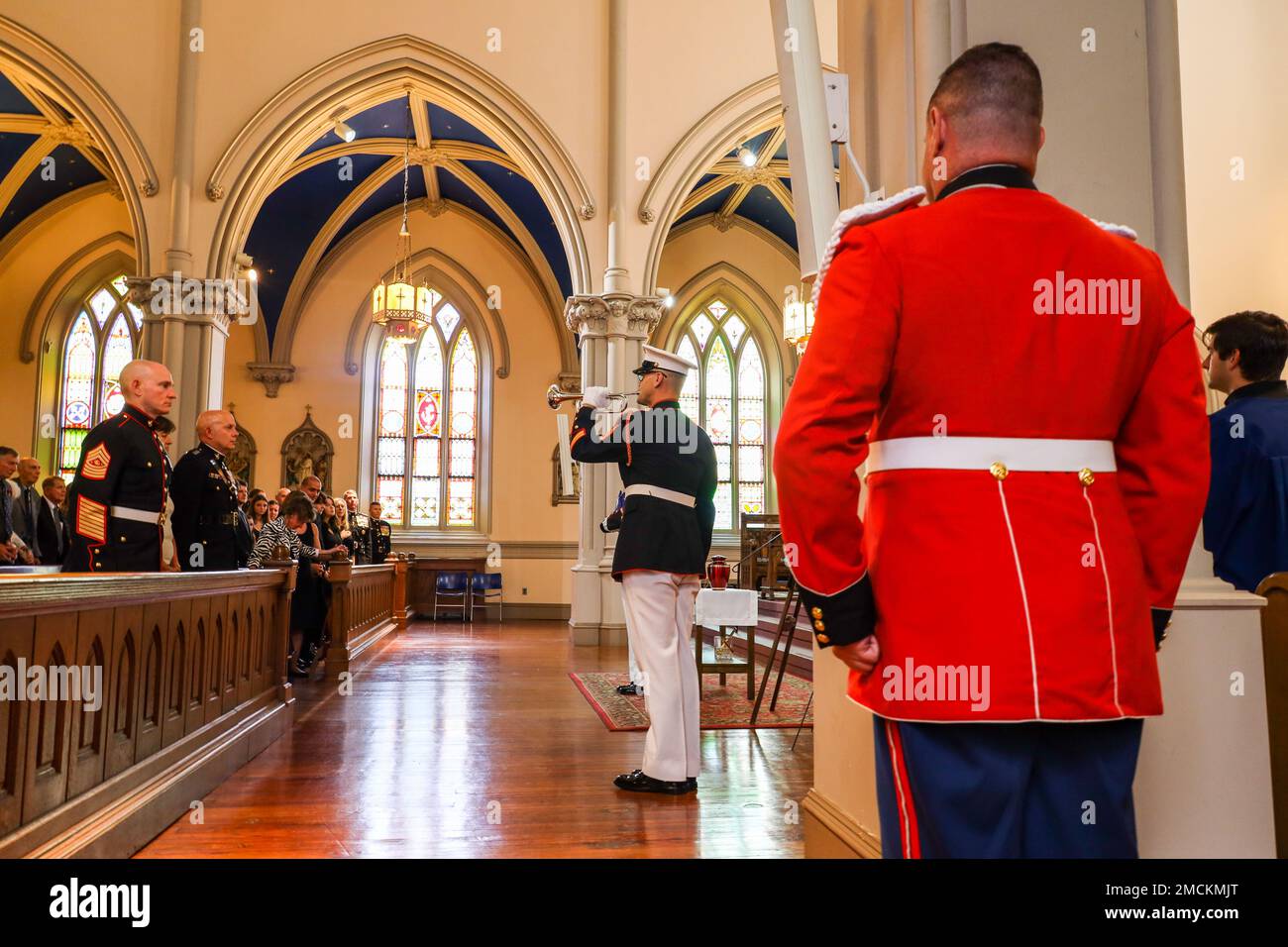 A Marine Corps bugler plays taps at a memorial for Gen. Richard I. Neal ...
