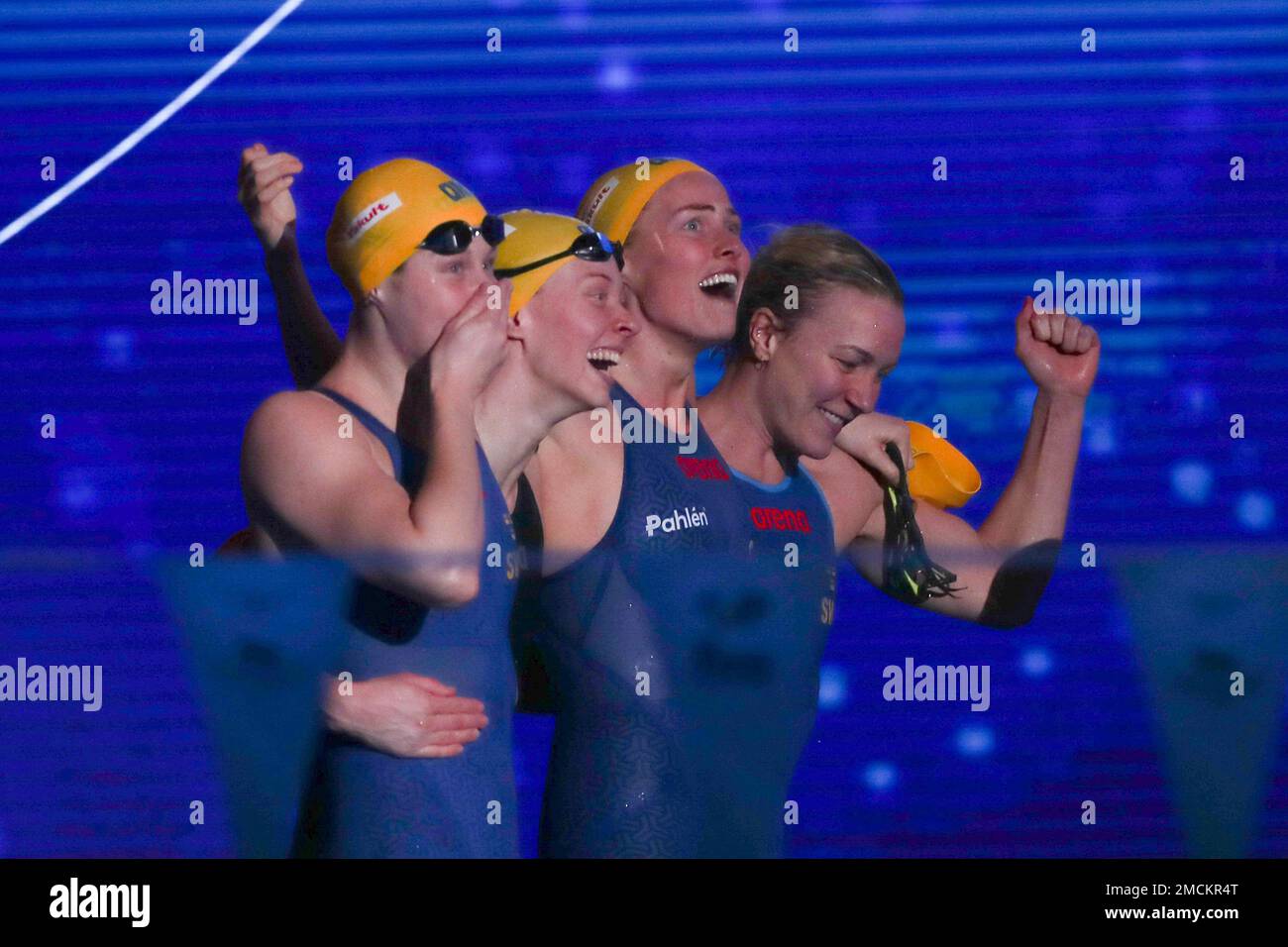 Team Sweden swimmers react after winning women's 4x50 medley relay during World Swimming ...
