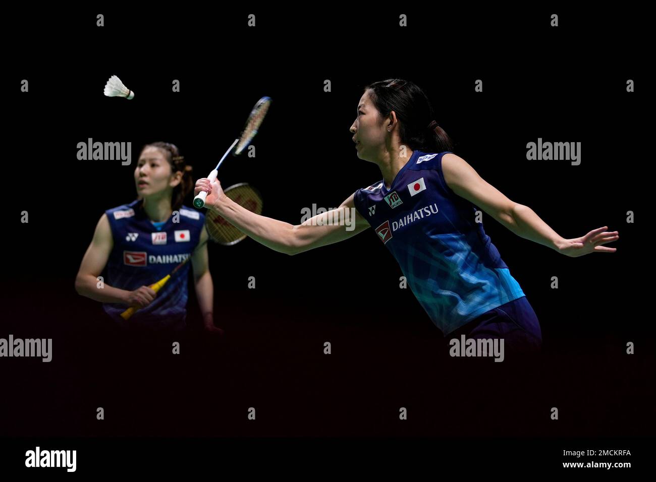 Japan's Nami Matsuyama, playing with Chiharu Shida, left, returns a shot to China's Chen Qing ...