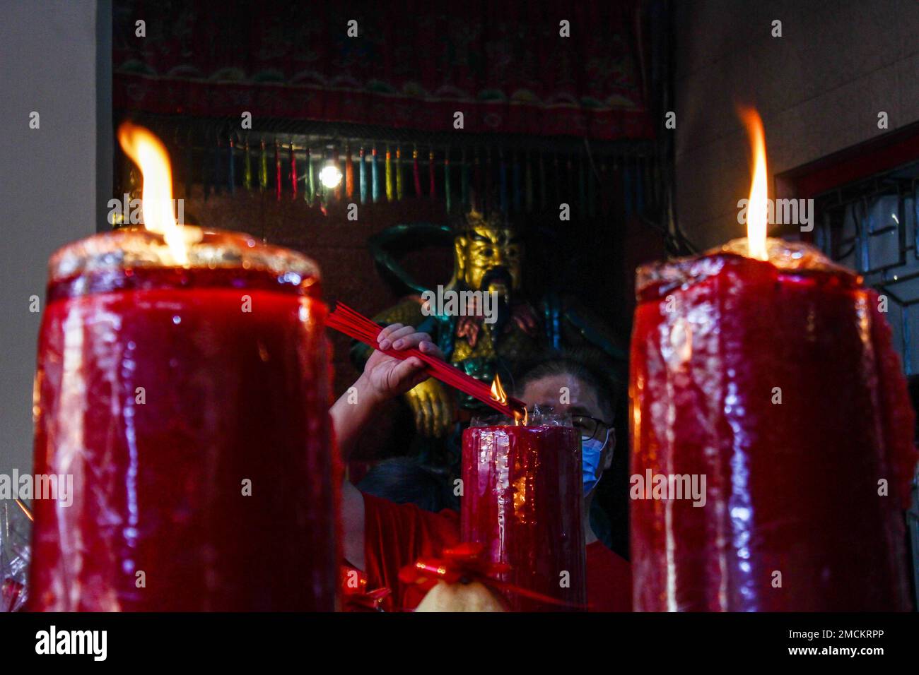 Bandung, West Java, Indonesia. 22nd Jan, 2023. A devotee burn incense ...