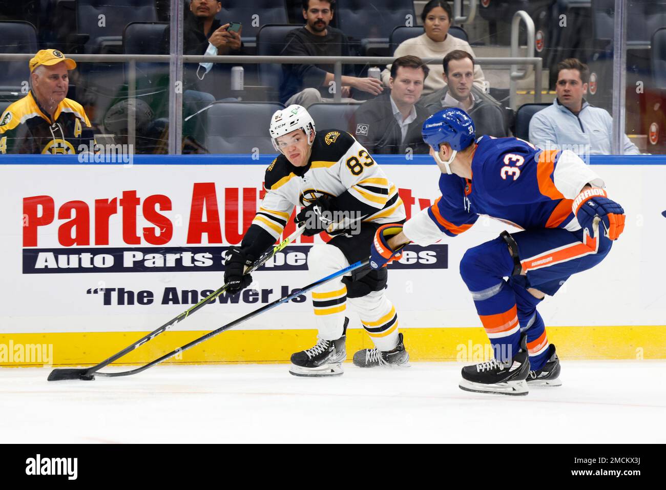 Boston Bruins center Karson Kuhlman (83) skates past New York Islanders ...