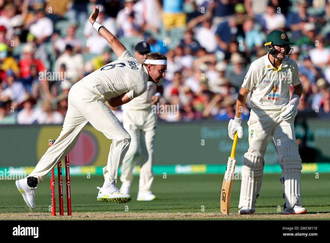 England's Stuart Broad, left, bowls as Australia's Marnus Labuschagne ...