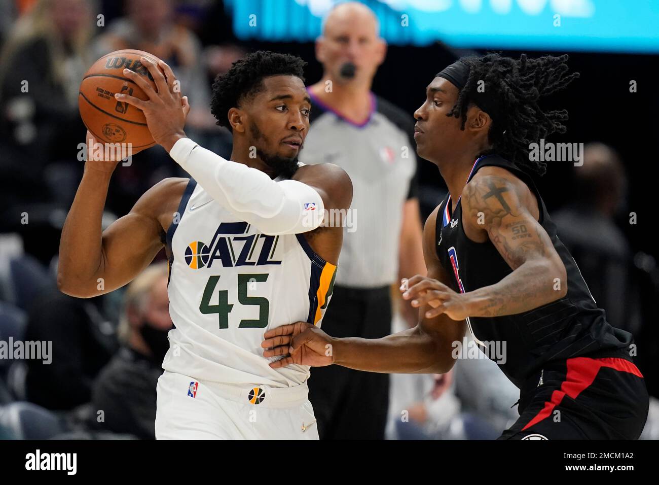 Los Angeles Clippers guard Terance Mann, right, guards Utah Jazz guard ...