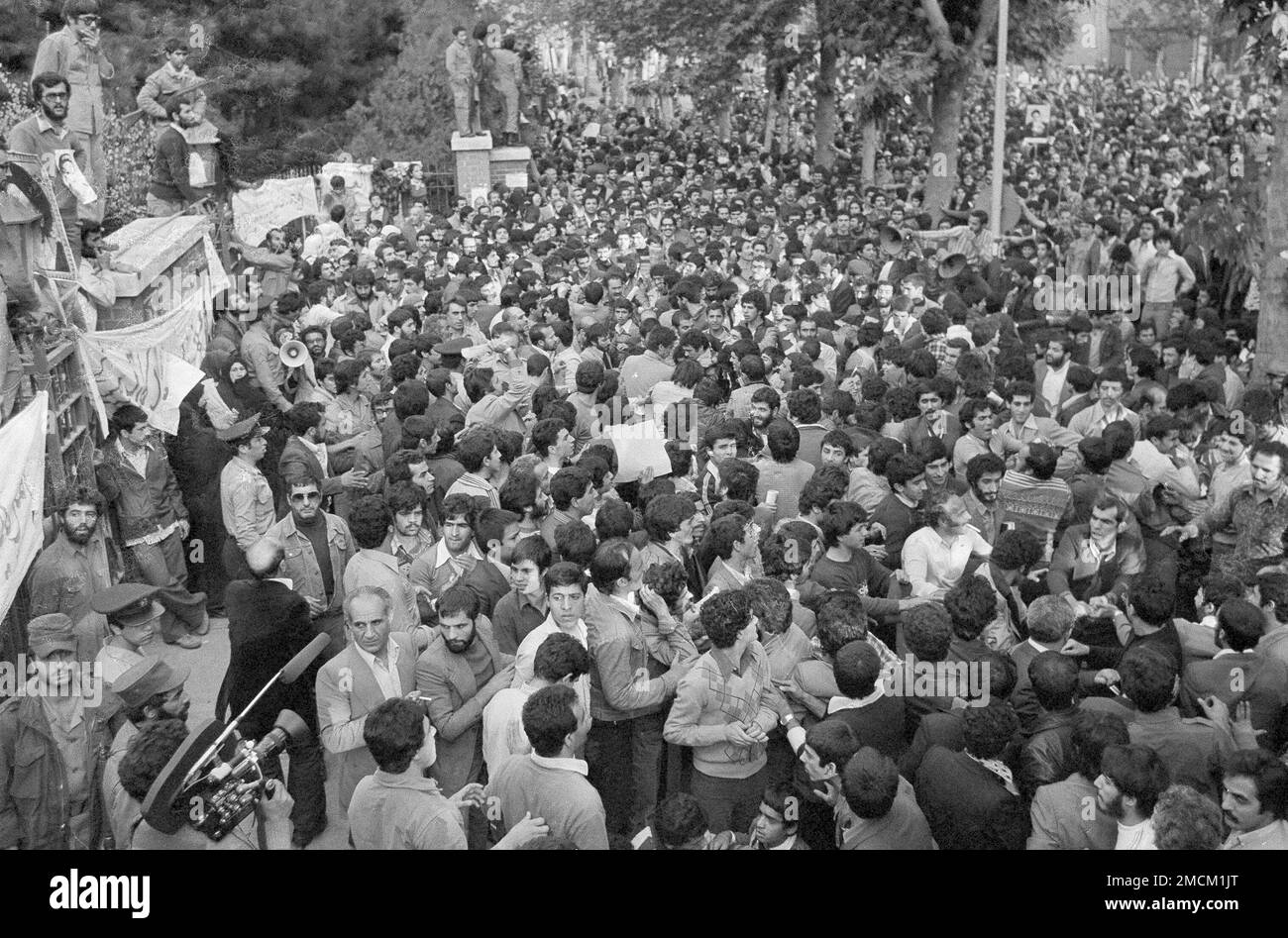 FILE - A mass of Iranian protesters is held back from the gates of the ...