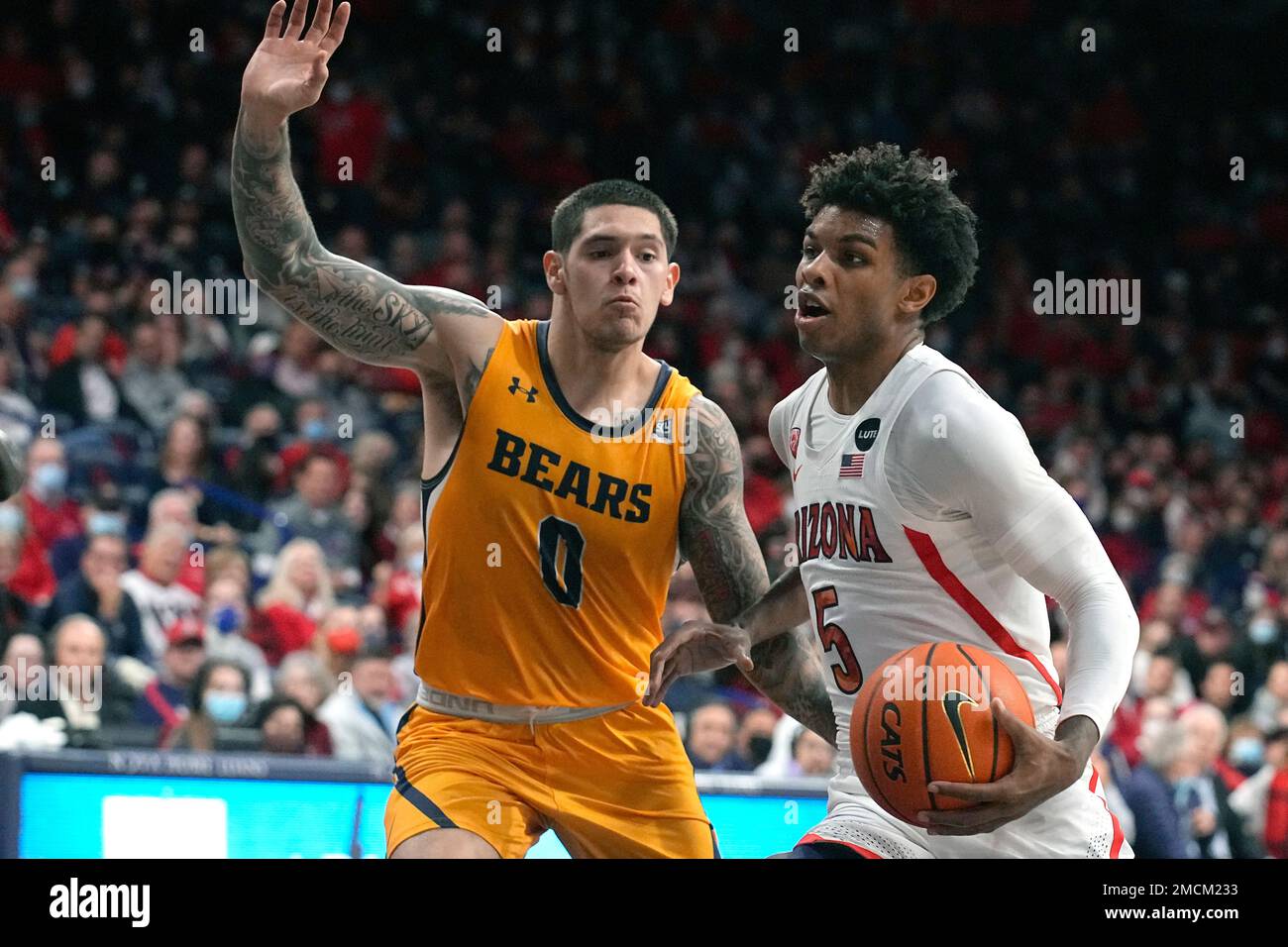Arizona guard Justin Kier drives on Northern Colorado guard Dru ...