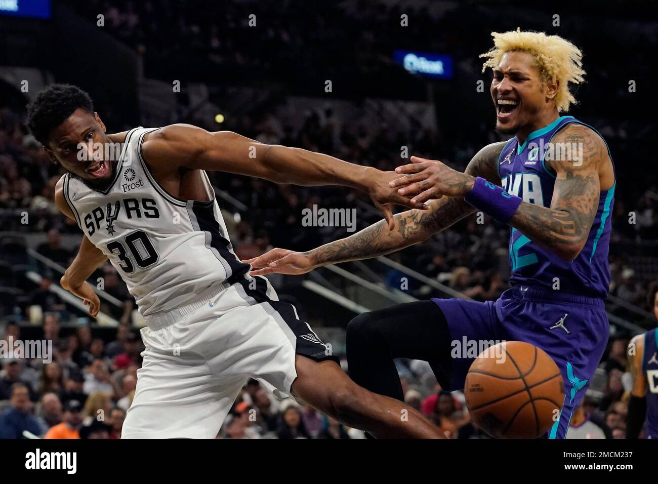 San Antonio Spurs forward Thaddeus Young (30) and Charlotte Hornets ...