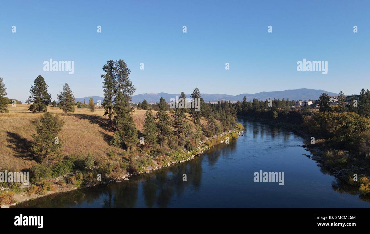 A fantastic shot of the Wenatchee River surrounded by vegetation in ...