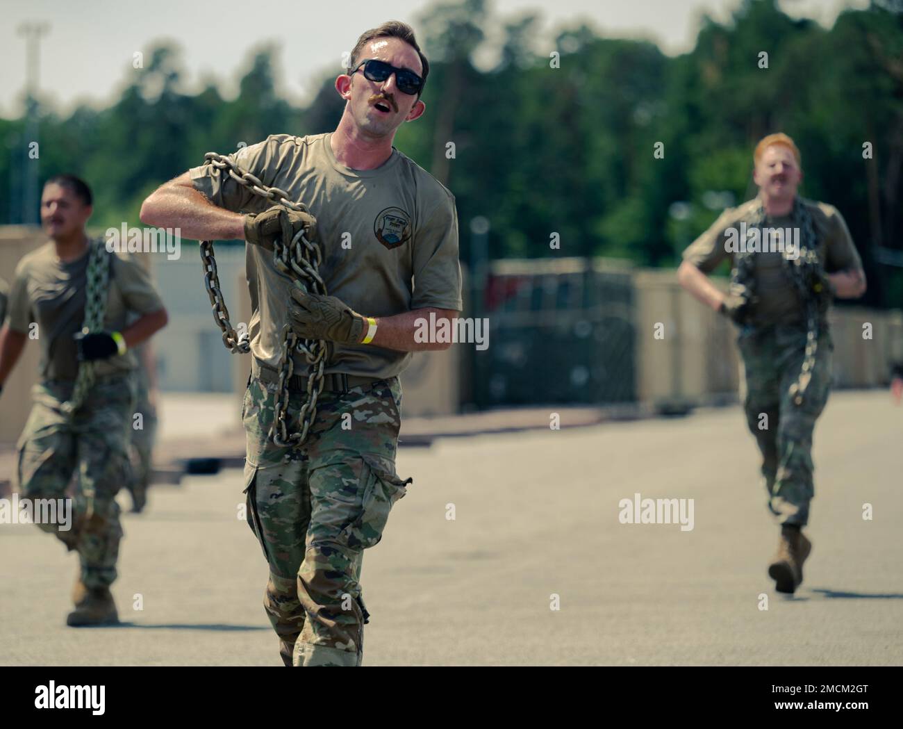 U.S. Air Force Airmen assigned to the 721st Aerial Port Squadron carry ...