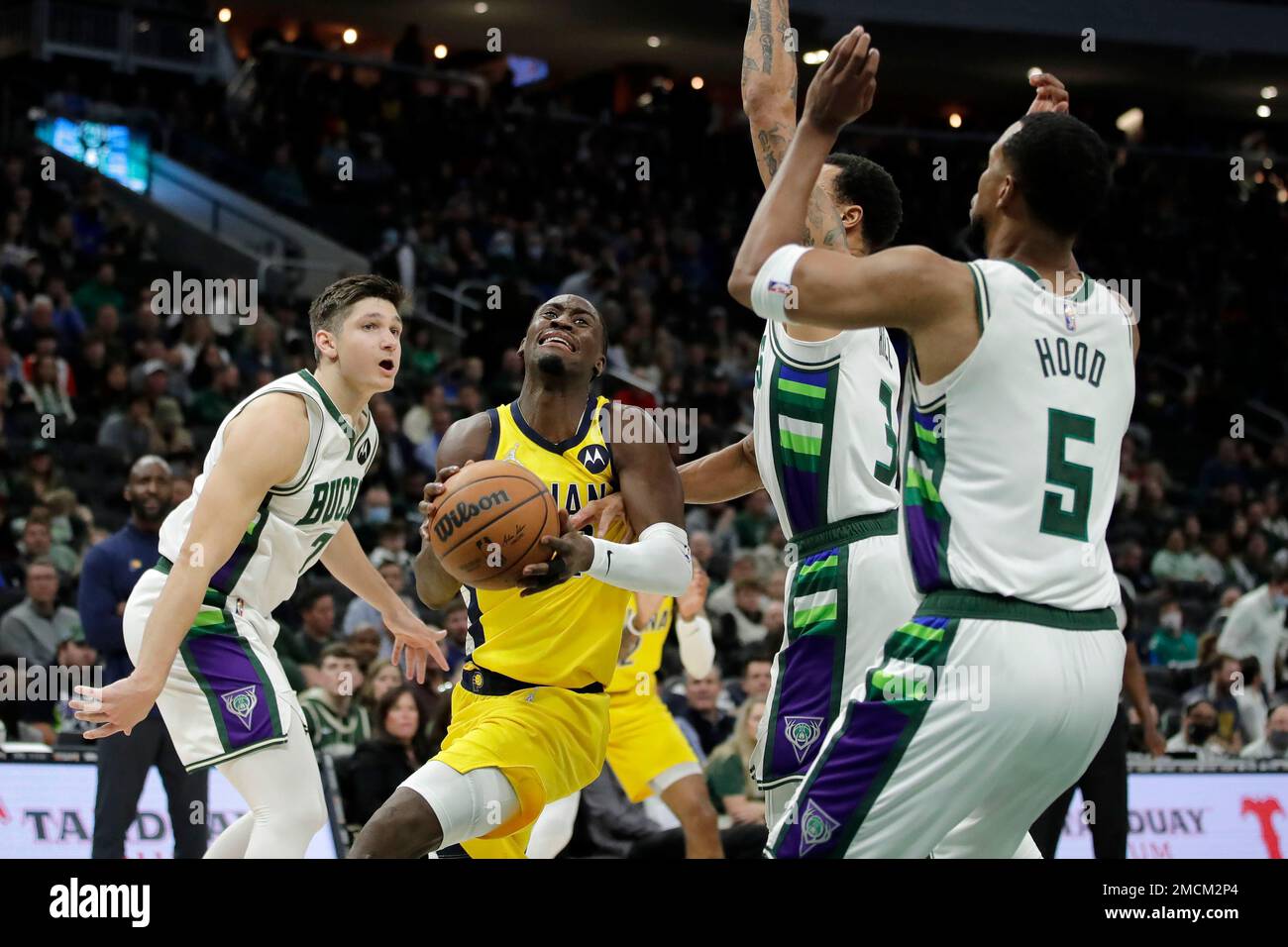 Indiana Pacers' Caris LeVert drives to the basket between Milwaukee ...