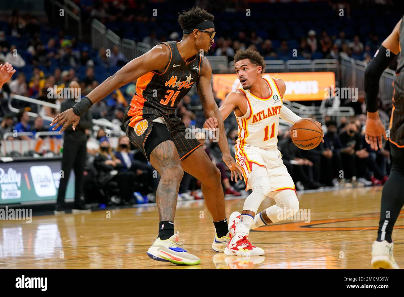 Atlanta Hawks guard Trae Young (11) makes a move to get around Orlando ...