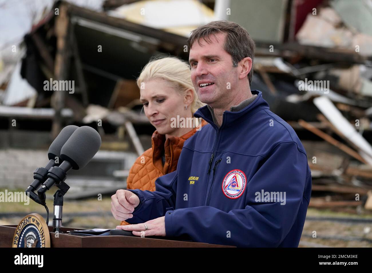 Kentucky Gov. Andy Beshear, standing next to his wife Britainy Beshear ...