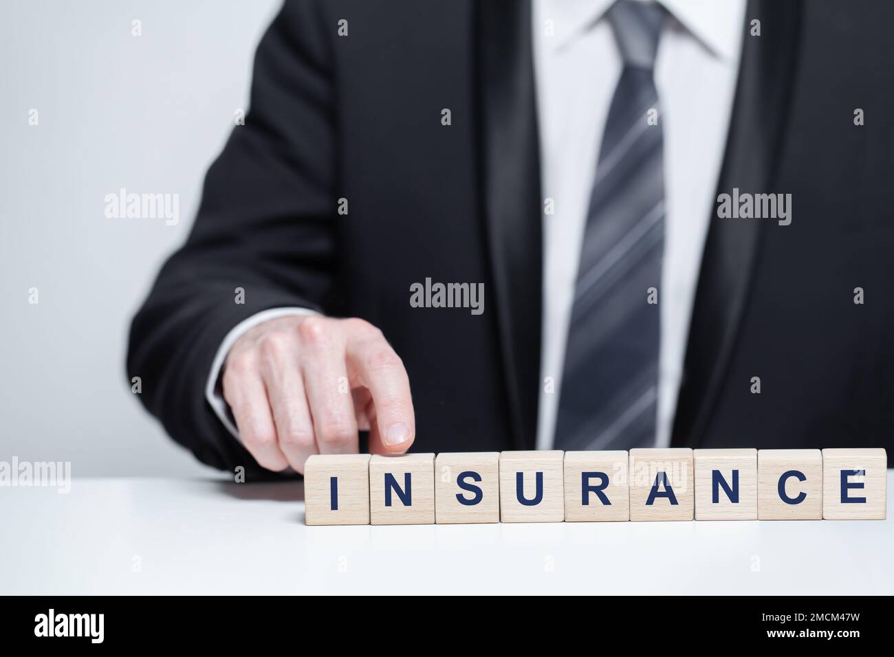 Wooden blocks with black word insurance, business insurance safety ...