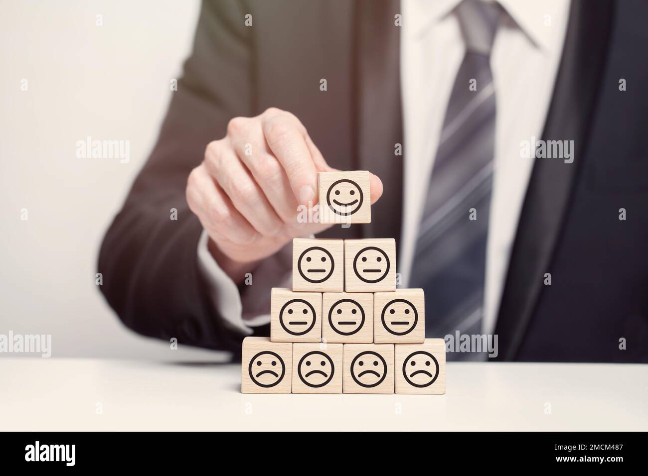 Business customer feedback concept, wooden cubes, happy and sad ...