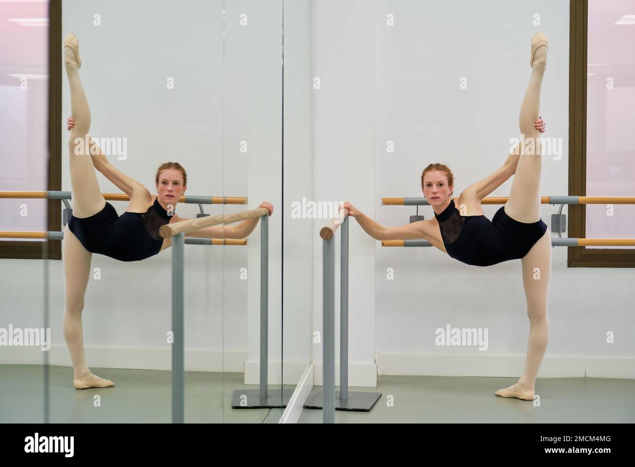 Young ballerina practicing ballet pose in a ballet school Stock Photo ...