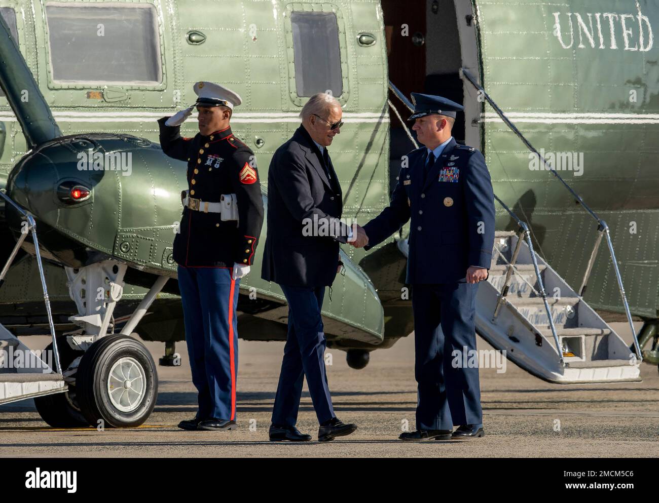 President Joe Biden shakes hands with Col. Matthew Jones, Commander ...