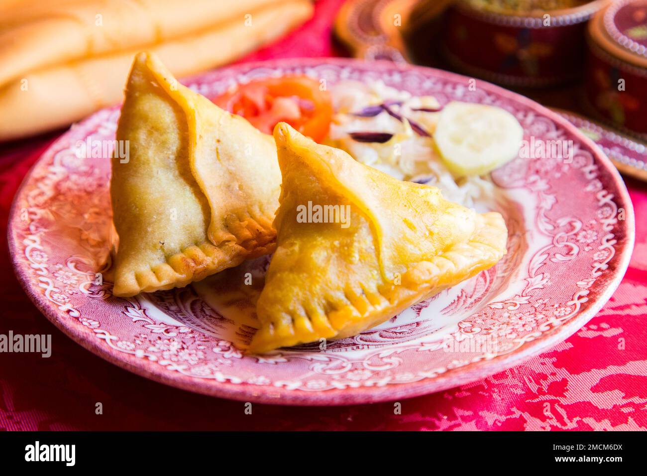 Samosa is a fried or baked dumpling with savory filling, such as ...