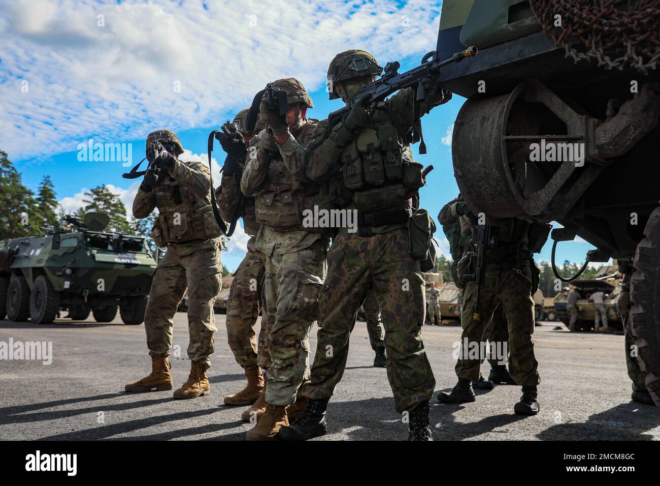 Finnish soldiers assigned to the Satakunta Jaeger Battalion, and U.S ...