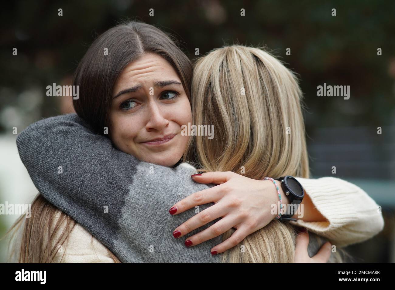 Hypocritical girl hugs a friend but gets bored of being close to her ...