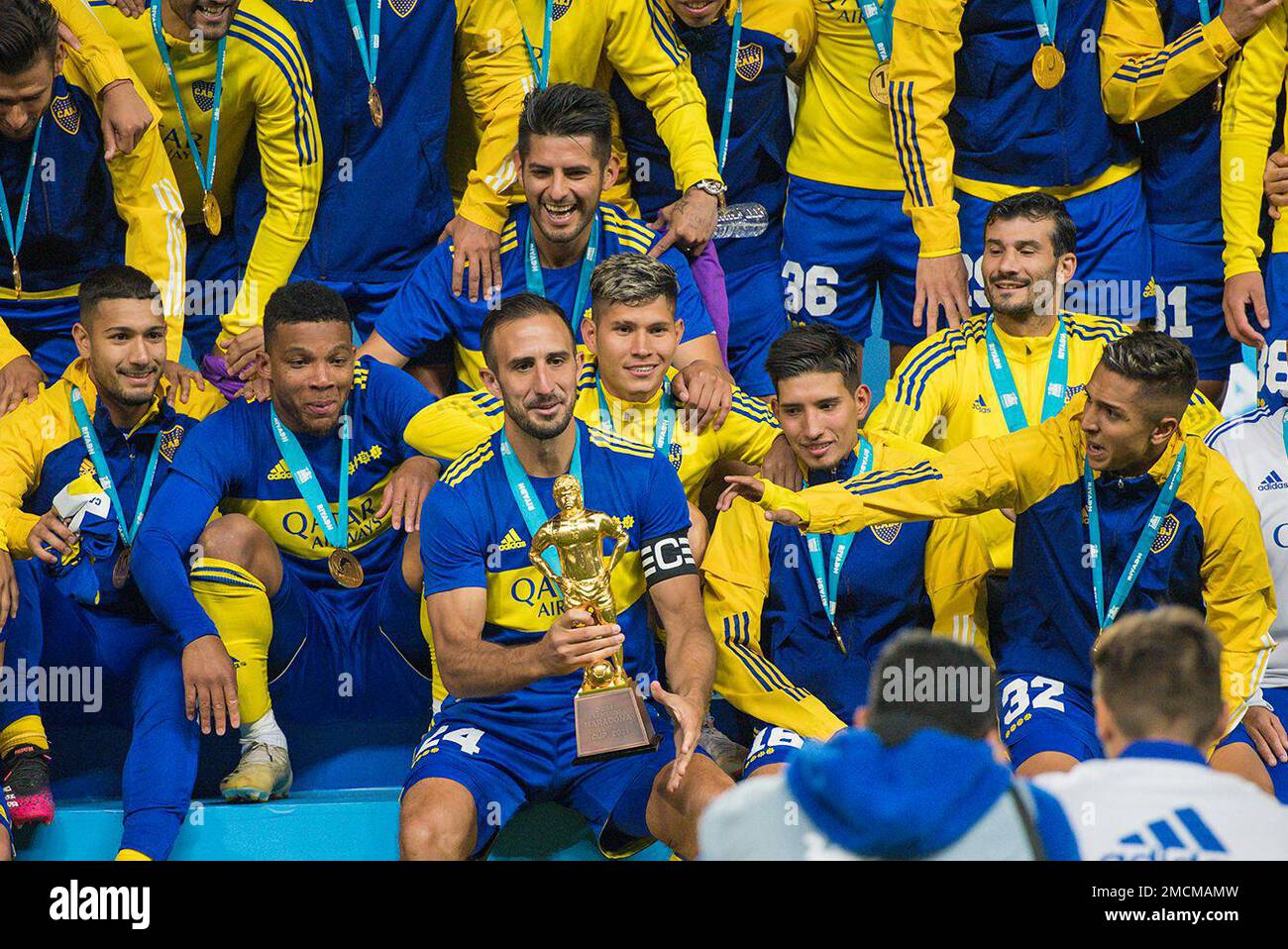Argentina's Boca Juniors players celebrate the trophy of Maradona Cup ...