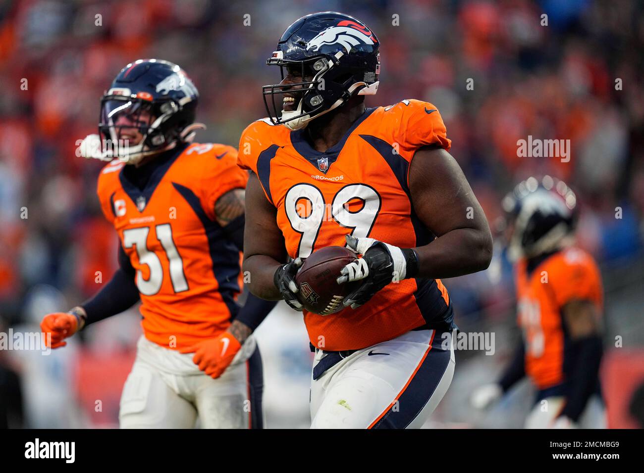 Denver Broncos defensive end DeShawn Williams (90) celebrates against ...