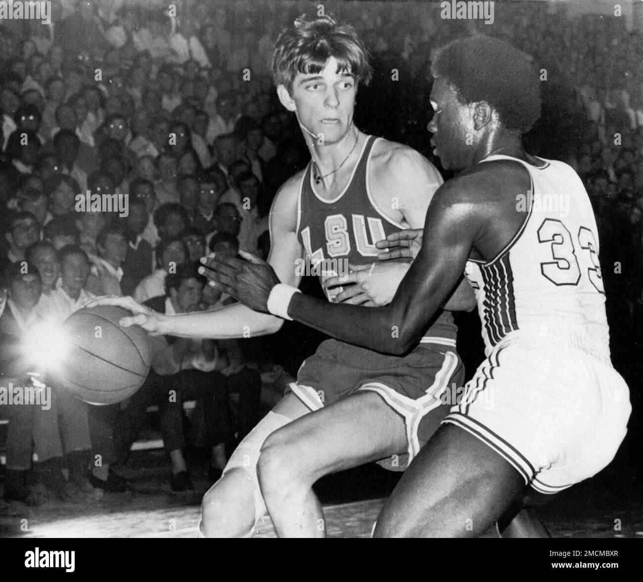 FILE -Pete Maravich of Louisiana State moves in for a basket against Tulane's Harold Sylvester ...