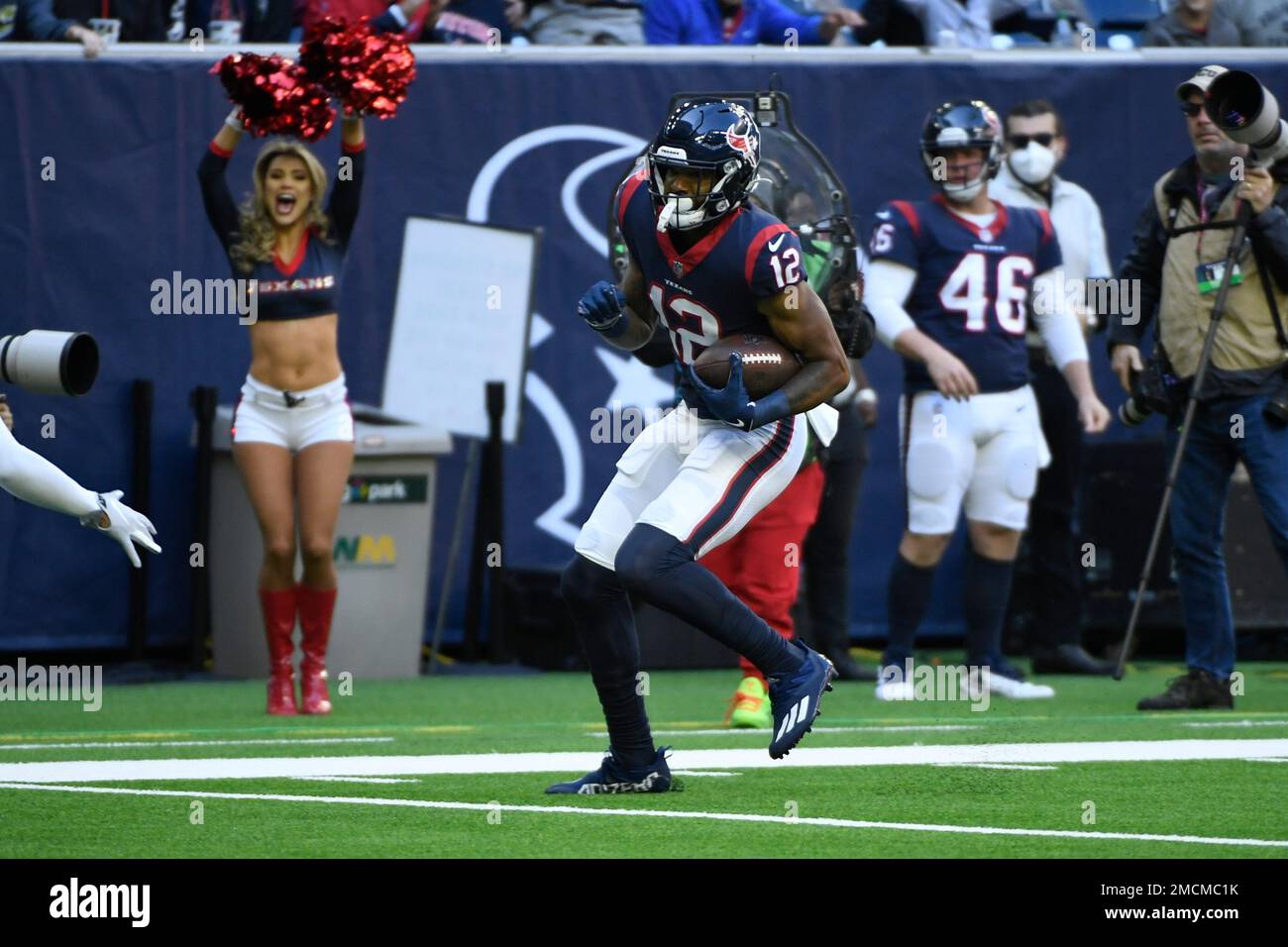 Houston Texans wide receiver Nico Collins (12) runs with the ball ...