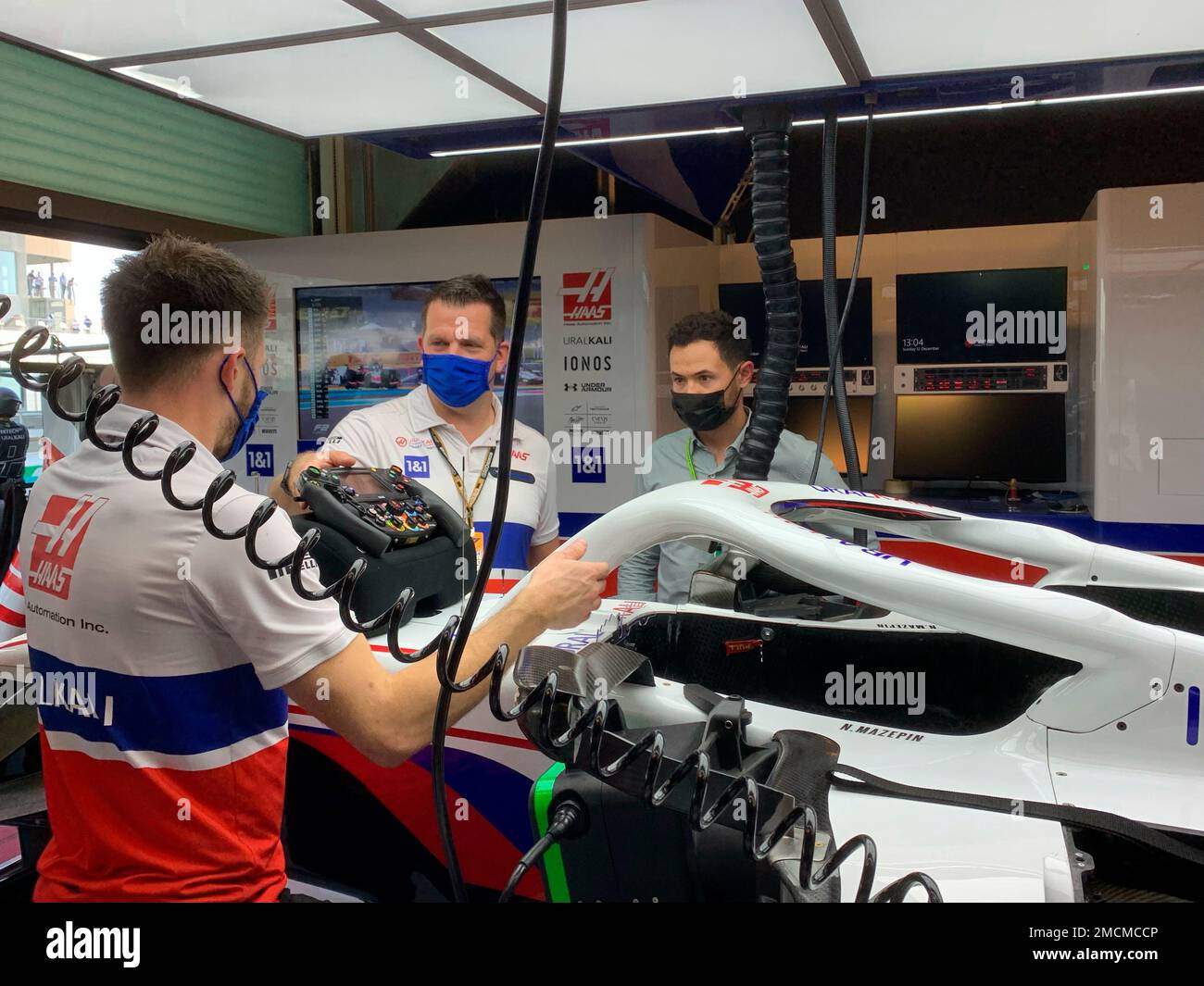 NASCAR champion Kyle Larson gets a close look of a Formula One car and ...