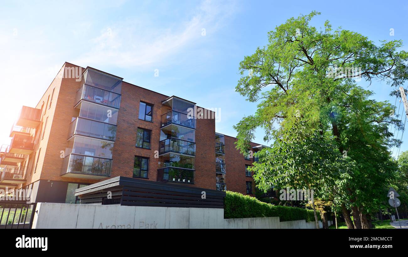 Eco architecture. Green tree and apartment building. The harmony of ...