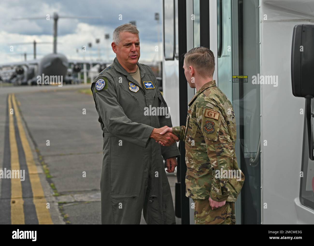 U.S. Air Force Gen. Mike Minihan, Air Mobility Command commander, left ...