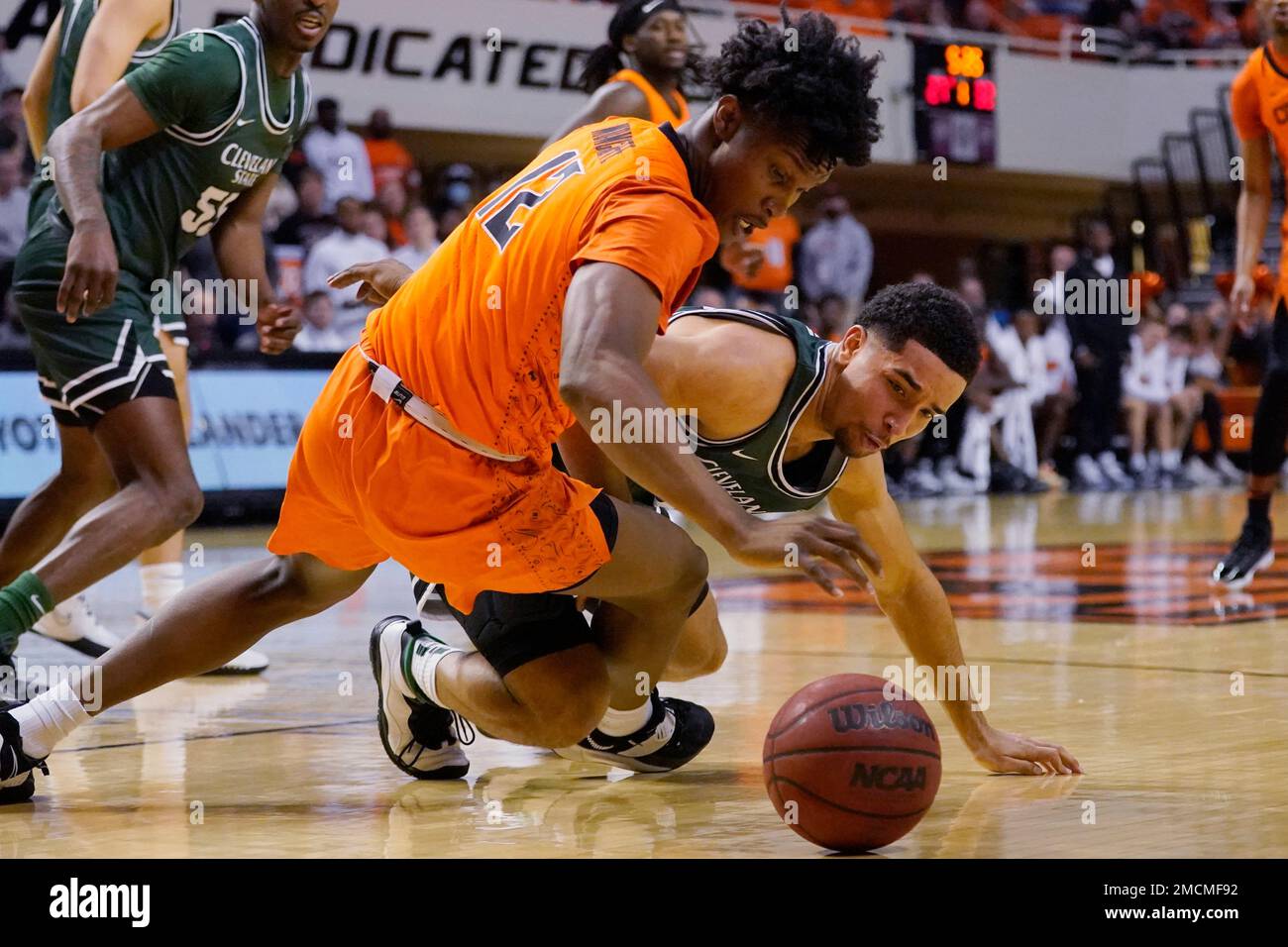 Oklahoma State forward Matthew-Alexander Moncrieffe (12) and Cleveland ...