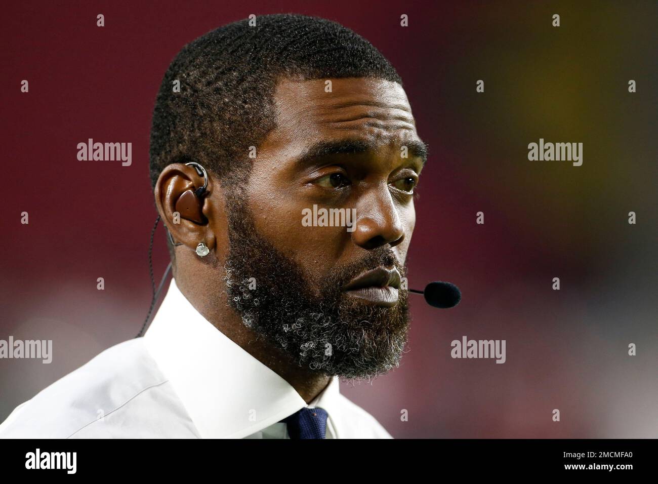 Former NFL player and current television analyst Randy Moss walks on ...