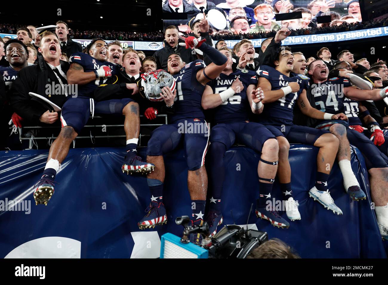 Navy celebrates after an NCAA college football game against Army on ...