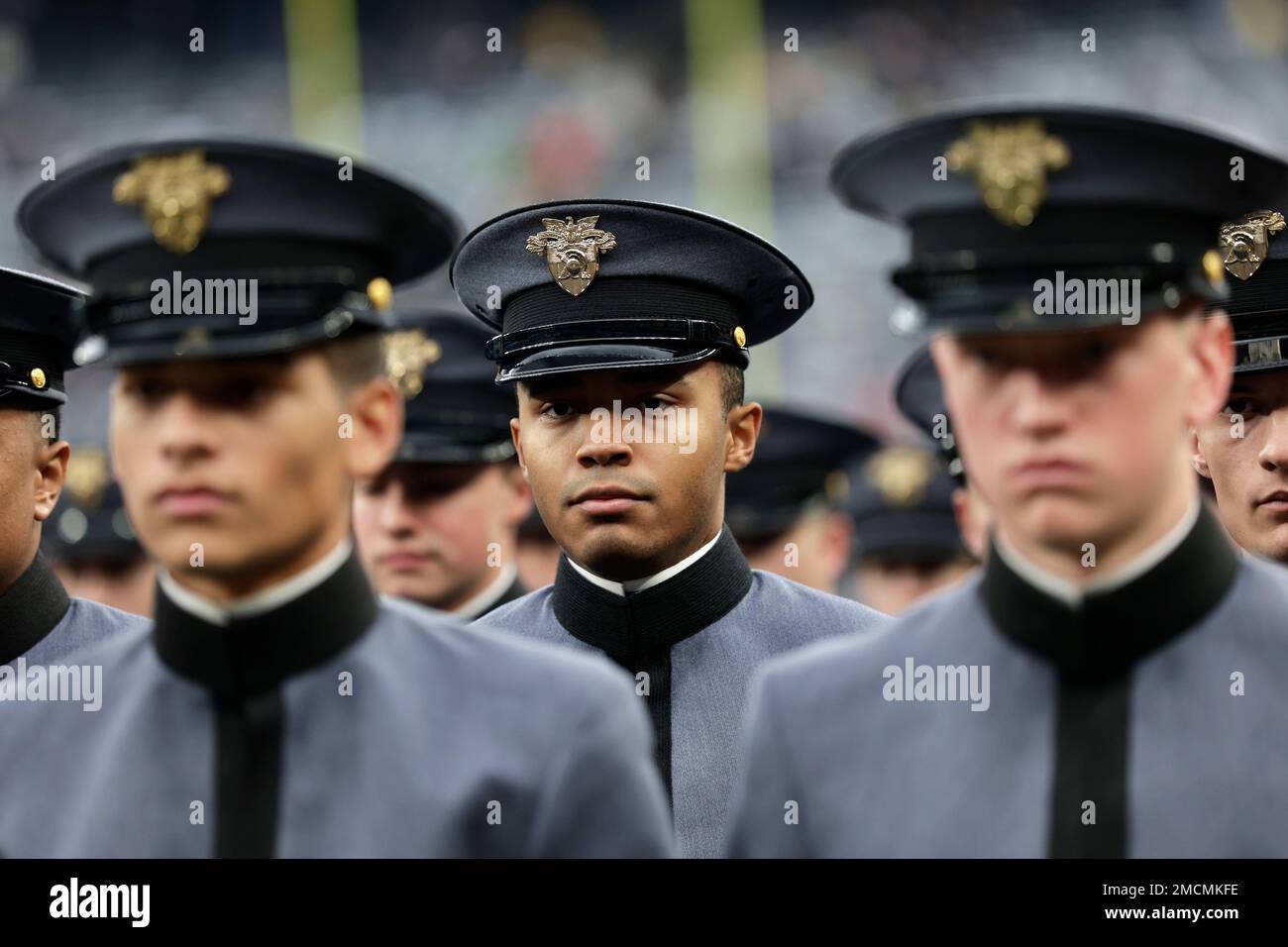 Army cadets march on the field before an NCAA college football game ...