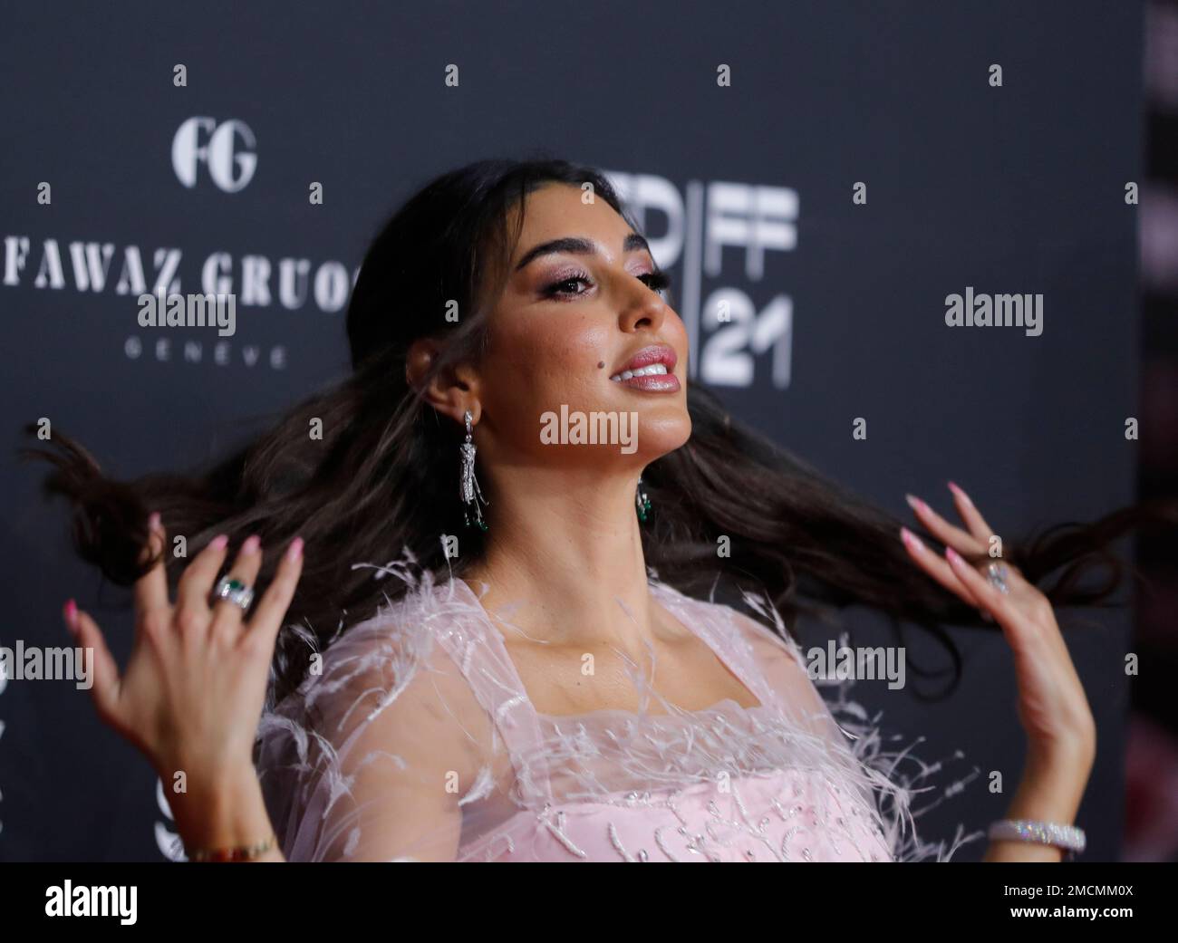 Egyptian actress Yasmine Sabri poses as she arrives to attend the ...